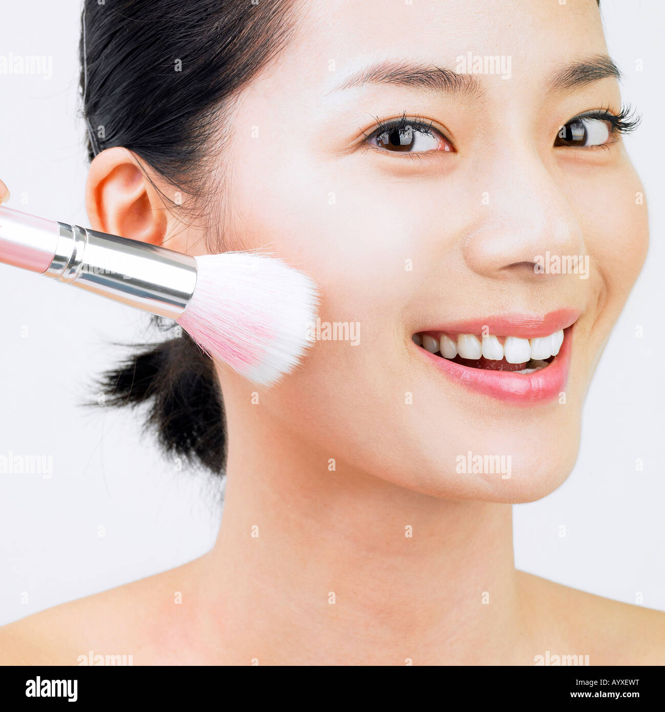 a woman's face put with brush Stock Photo - Alamy