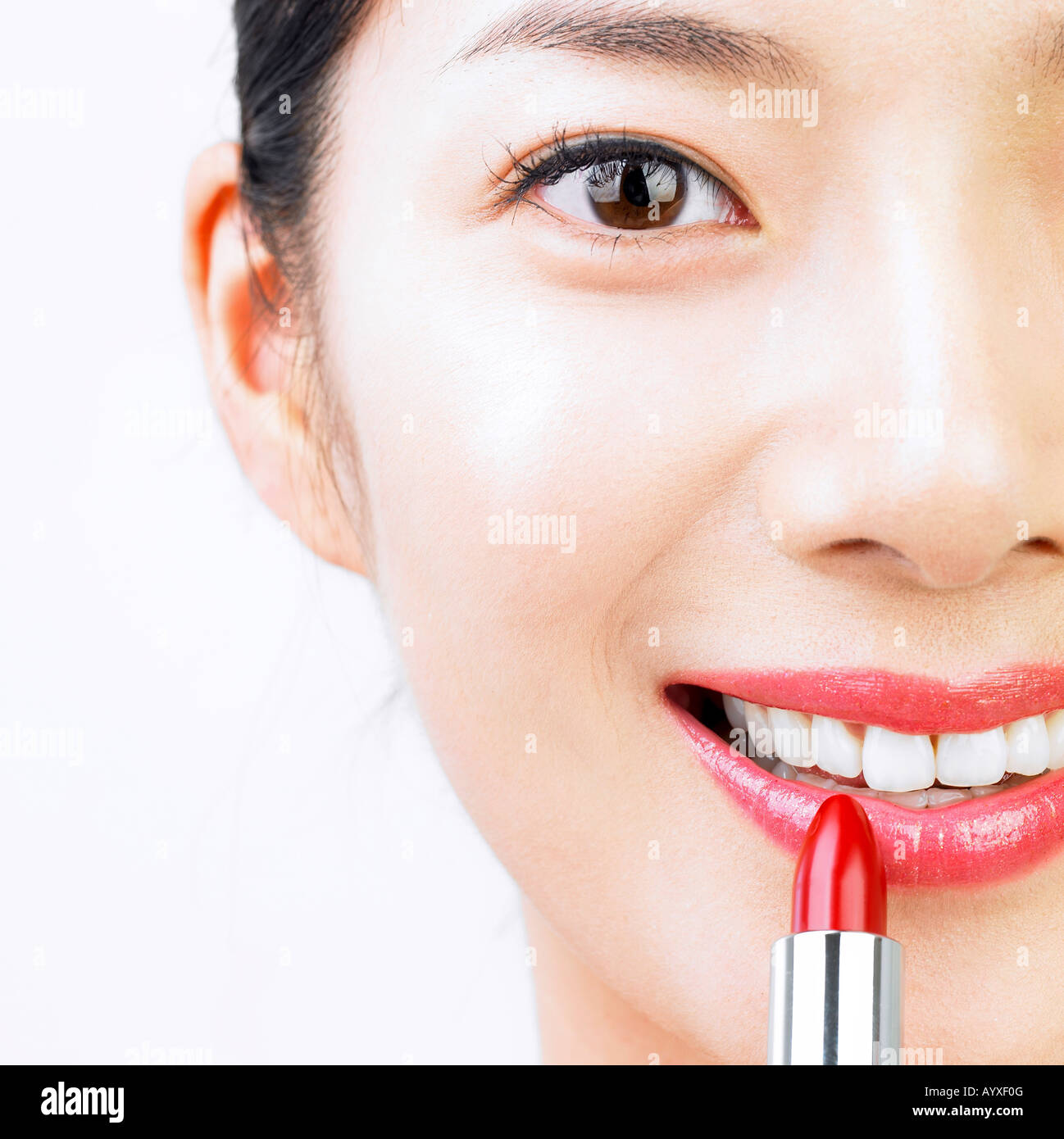 close up a woman's face painted with a lipstick Stock Photo - Alamy