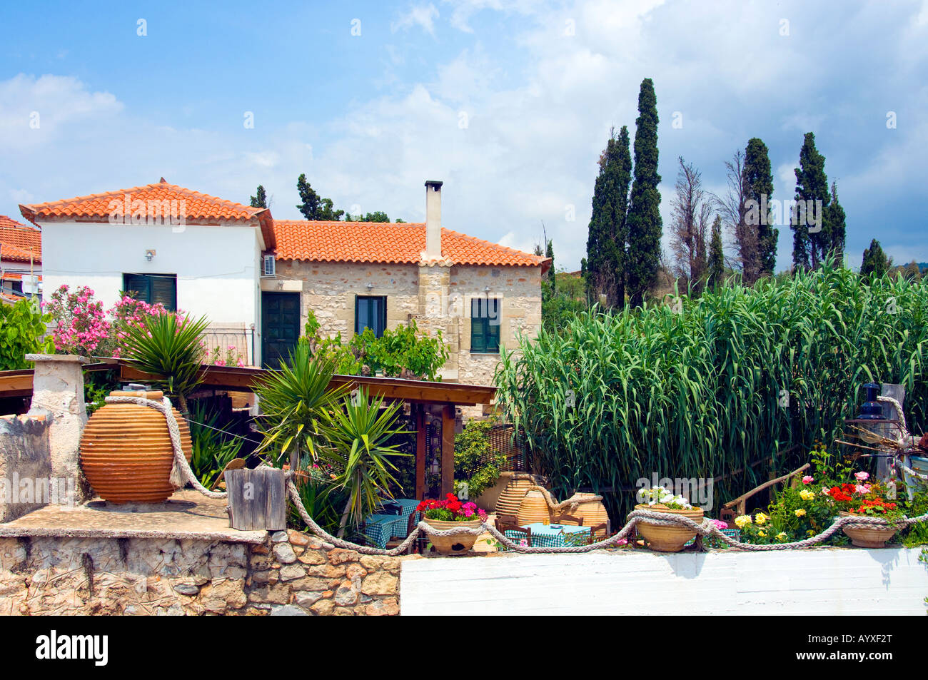Flowers and architecture in the village of Stoupa Greece Stock Photo ...