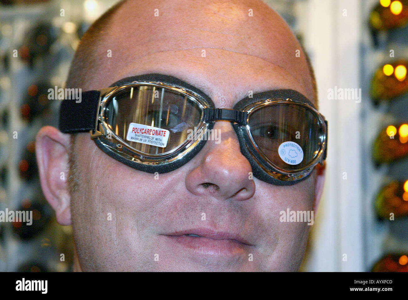Man trying new pair of sun glasses Stock Photo - Alamy