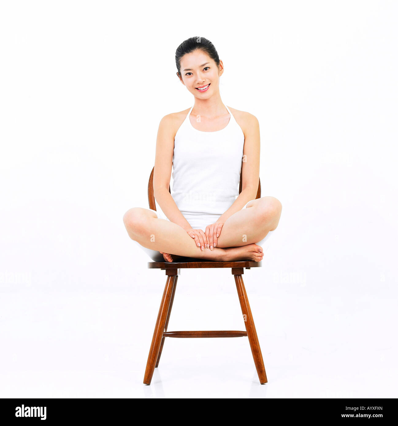 a woman sitting on the chair Stock Photo - Alamy