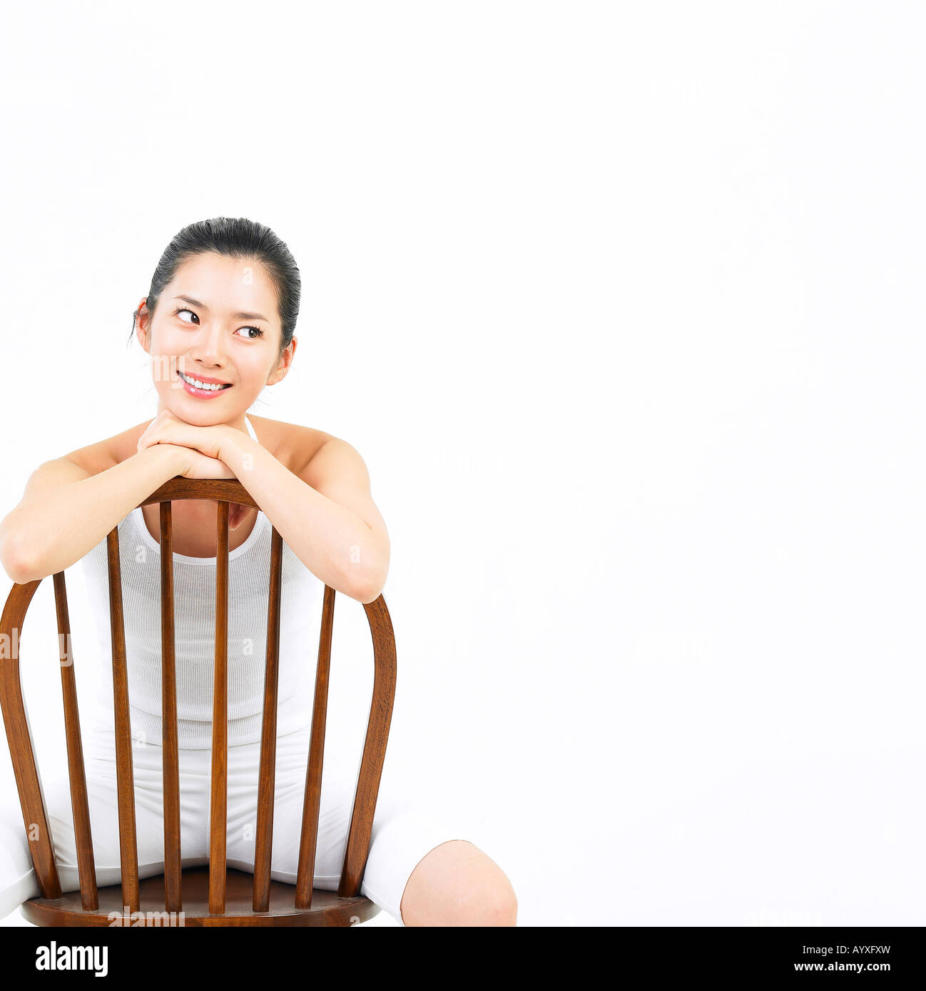a woman sitting on the chair placed to reverse Stock Photo - Alamy