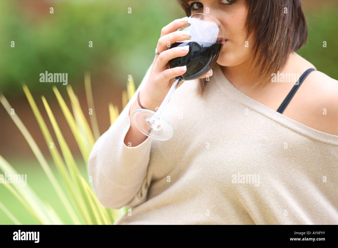 Teenage Girl Drinking Red Wine Model Released Stock Photo - Alamy
