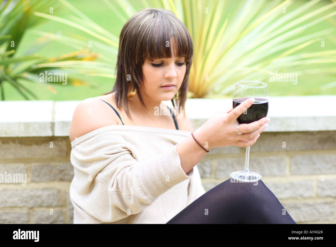 Teenage Girl Drinking Red Wine Model Released Stock Photo - Alamy