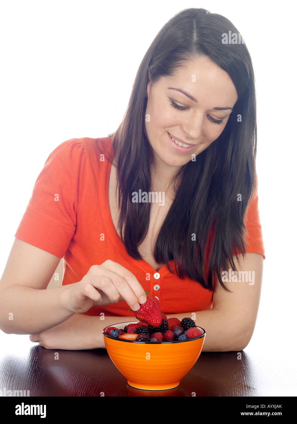 Young Woman Eating Mixed Berries Model Released Stock Photo - Alamy
