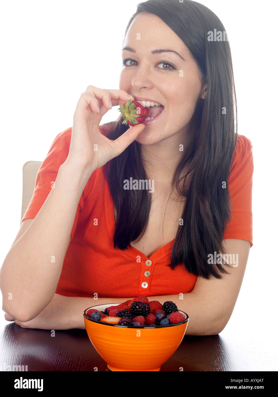 Young Woman Eating Mixed Berries Model Released Stock Photo - Alamy