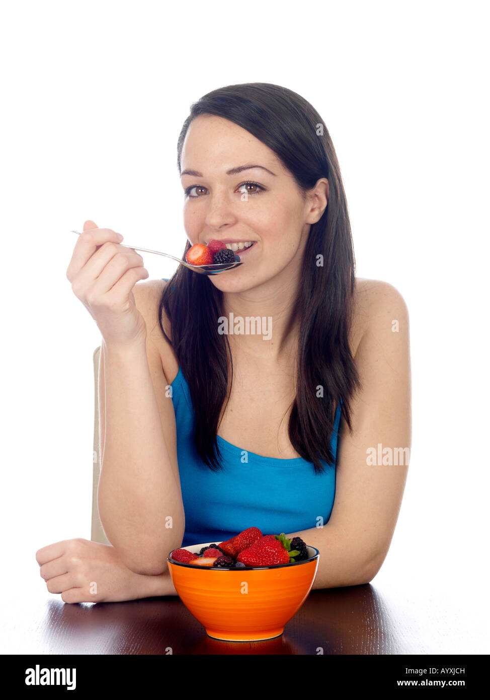 Young Woman Eating Mixed Berries Model Released Stock Photo - Alamy