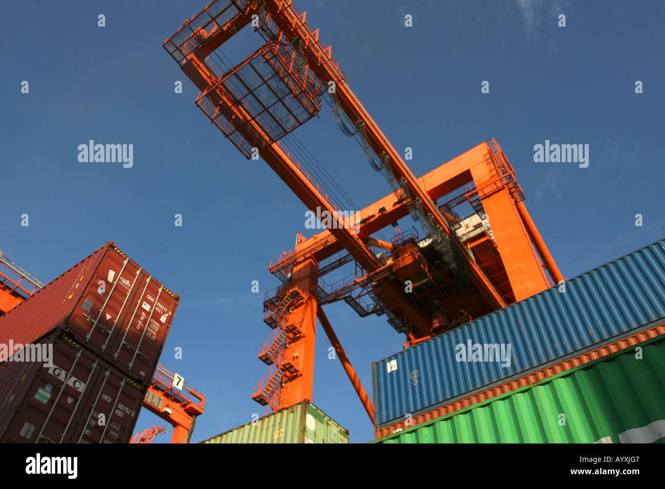 A crane moving containers Stock Photo - Alamy
