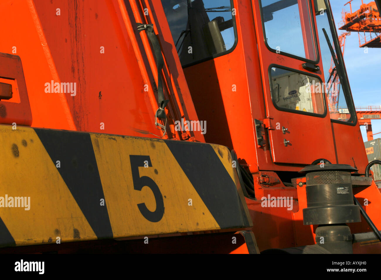 Close up of a container cargo lifting vehicle in a dock Stock Photo - Alamy