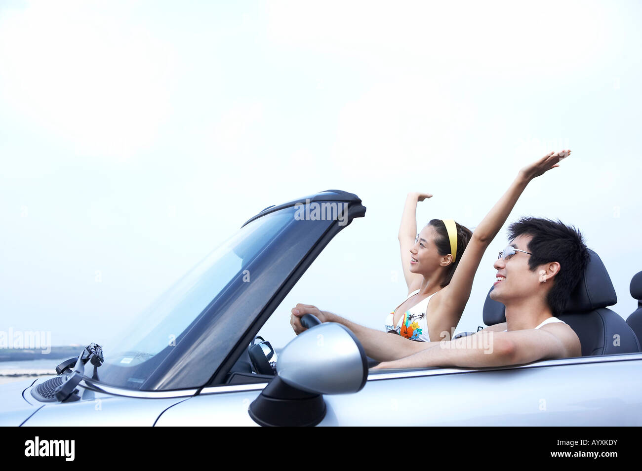 a couple enjoying with driving a car Stock Photo - Alamy