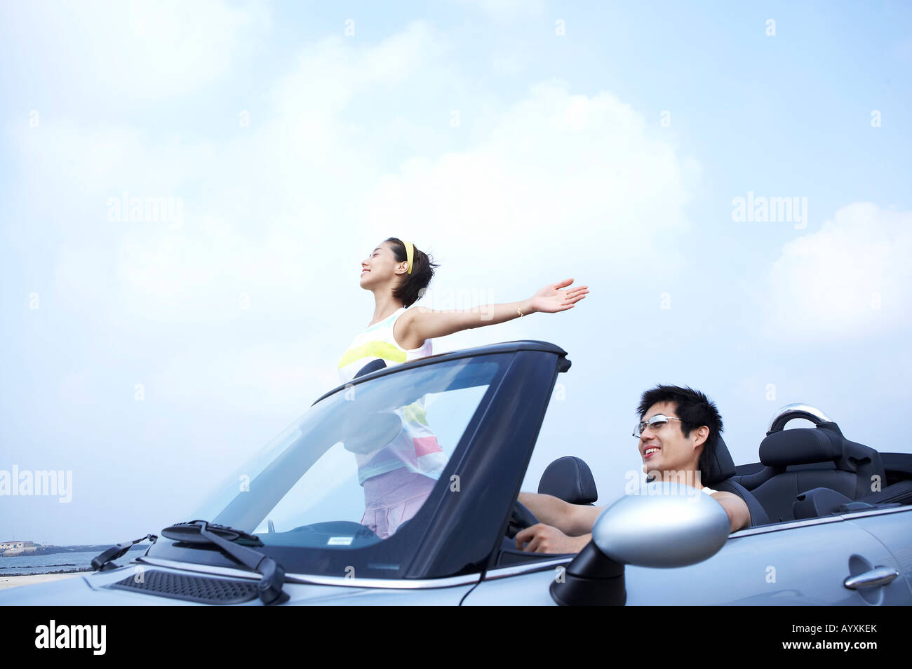 a couple enjoying with driving a car Stock Photo - Alamy