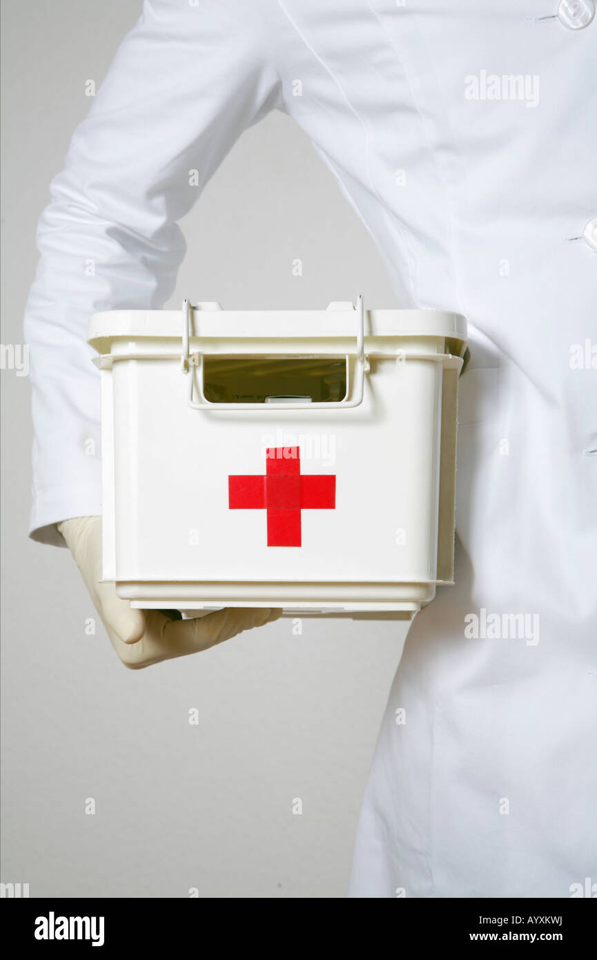Person carrying a box with red cross Stock Photo - Alamy