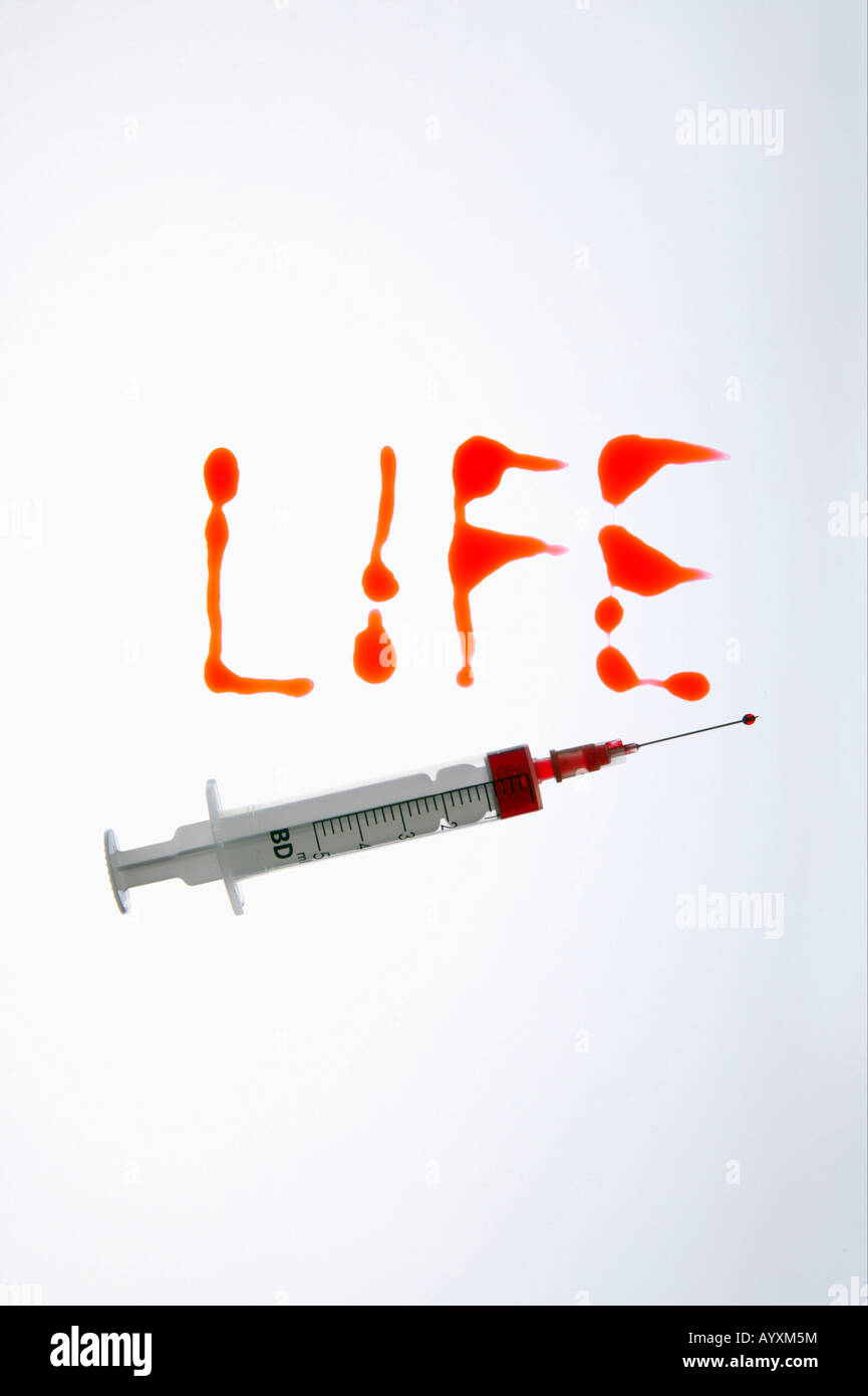 Red written word LIFE and a syringe Stock Photo - Alamy