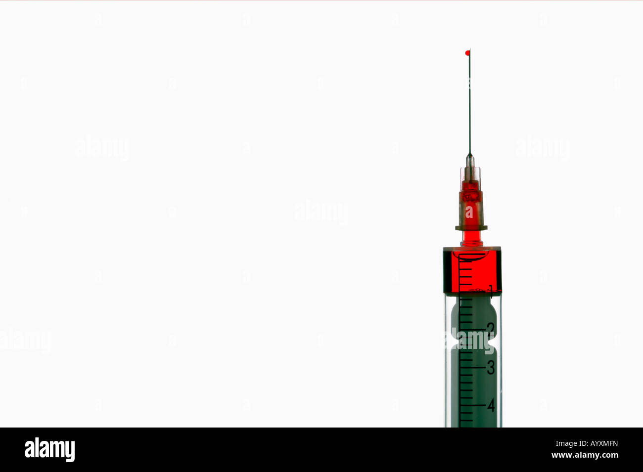 Syringe with red liquid Stock Photo - Alamy