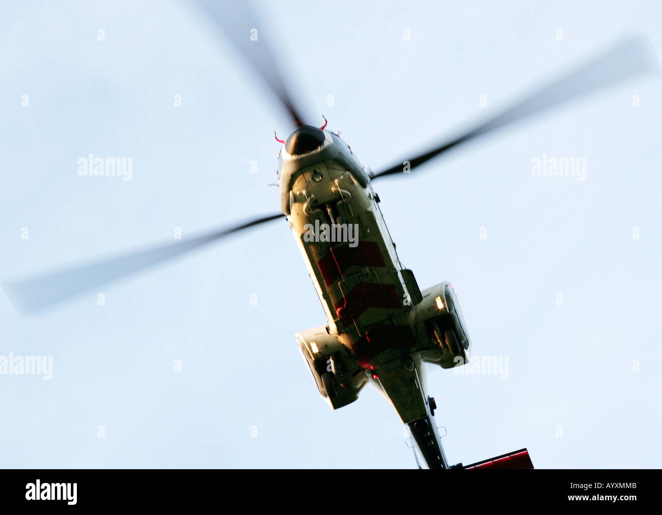 An image of a helicopter taken from underneath appraoching to land at ...