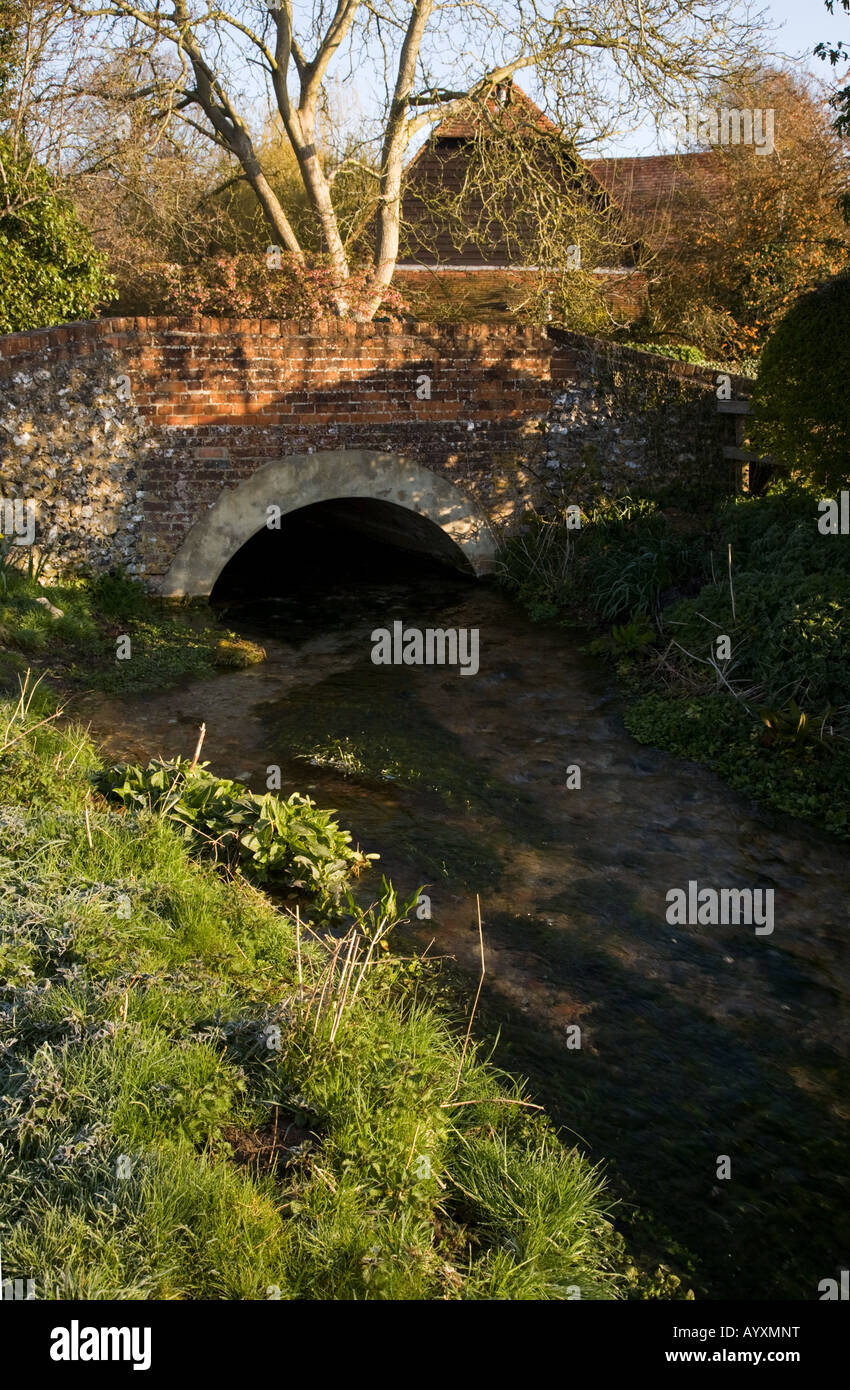 old red brick built road bridge crossing over the stream at Hambleden ...