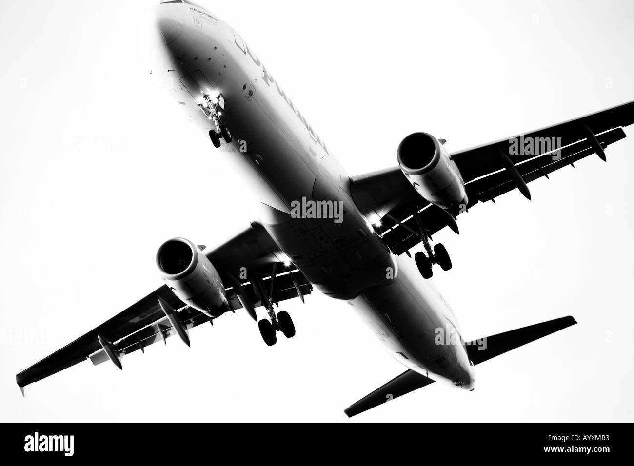 A landscape format image taken from underneath a jet aircraft with ...