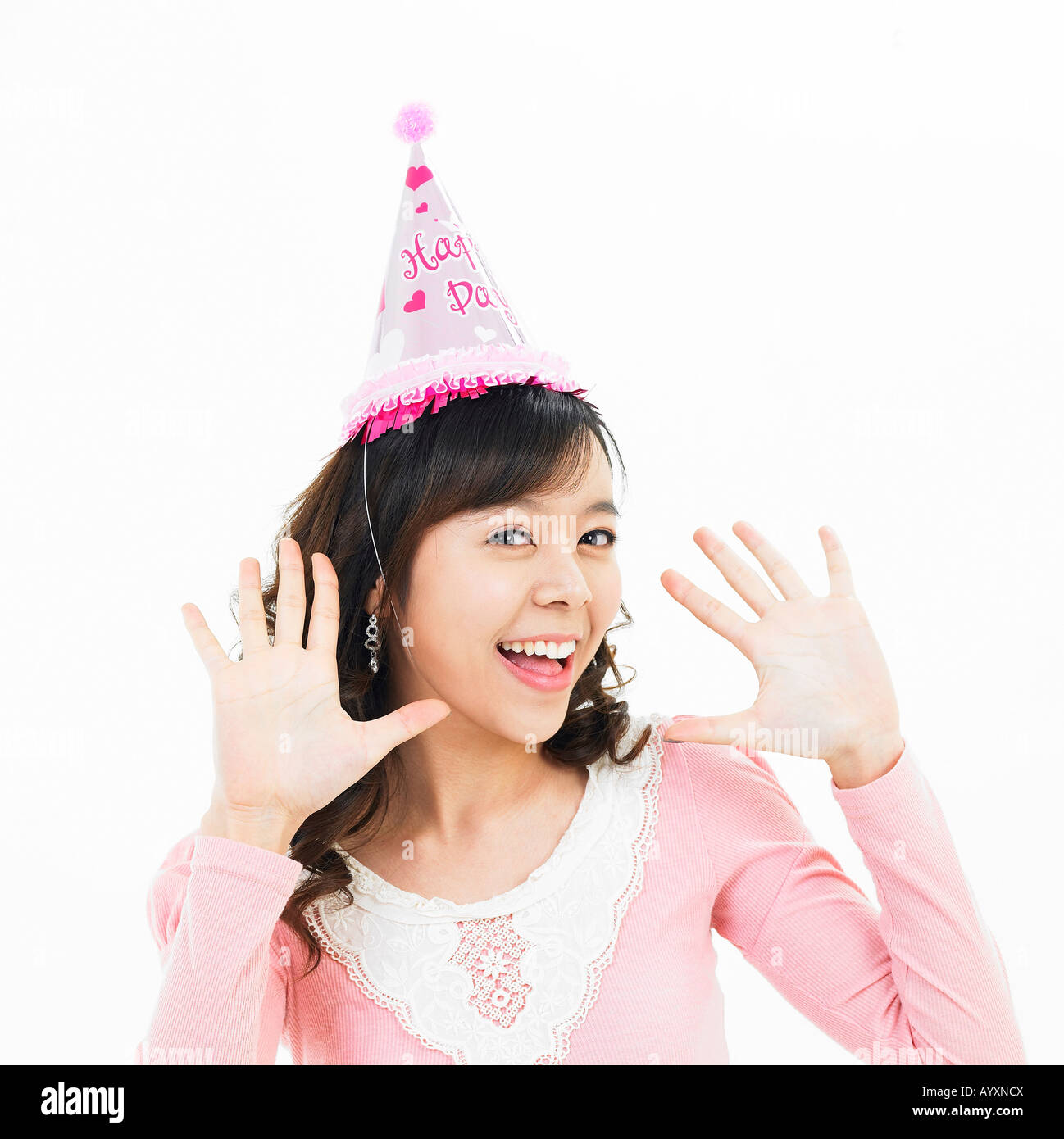 a smiling woman put a peaked hat with streching hands Stock Photo - Alamy
