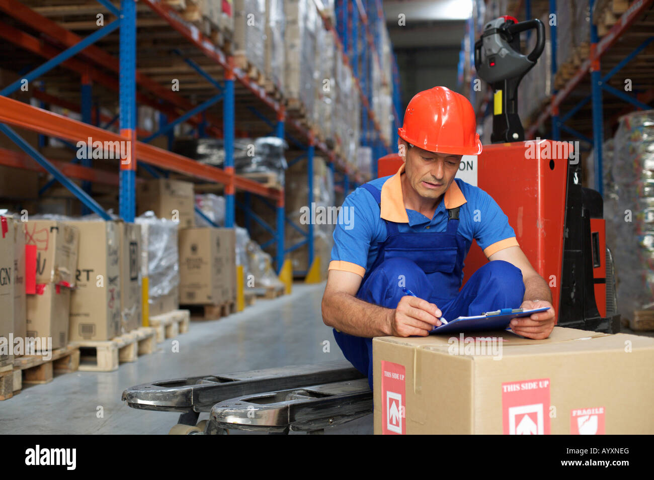 Person stooping and lifting box hi-res stock photography and images - Alamy