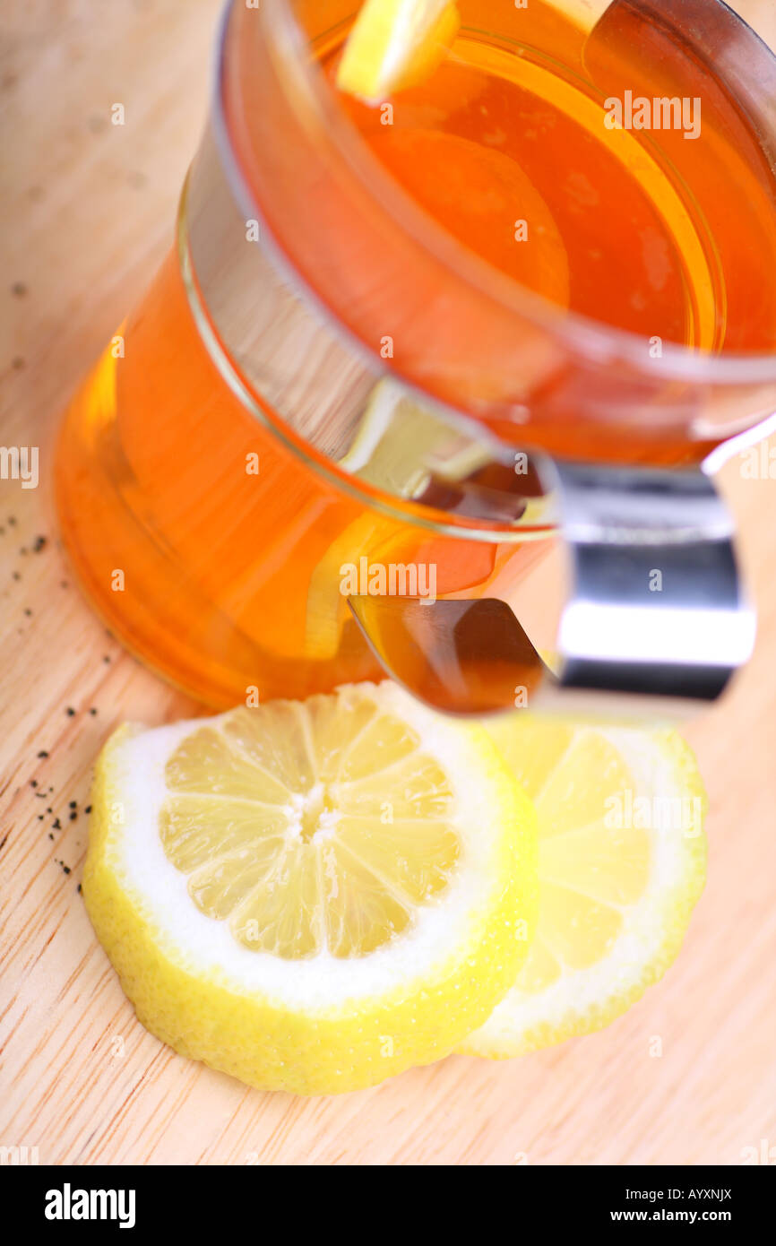 freshly made lemon tea with scattered tea leaves Stock Photo - Alamy