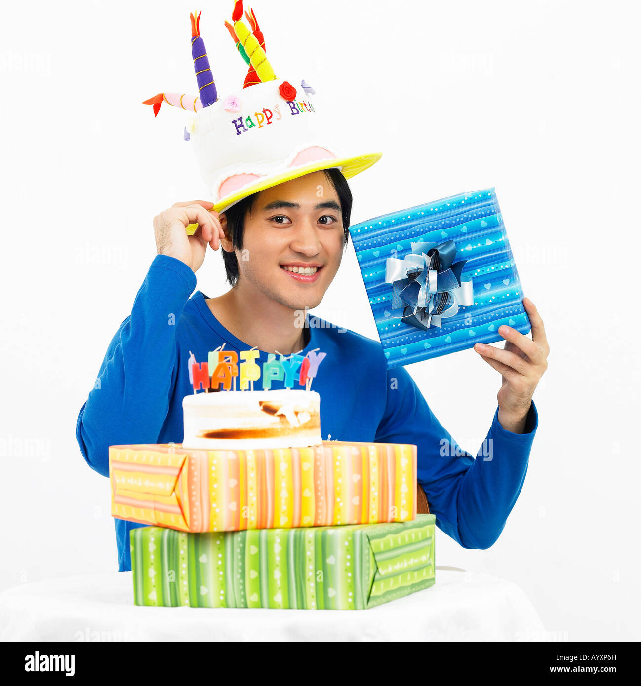 smiling man holding cake and gift box Stock Photo - Alamy