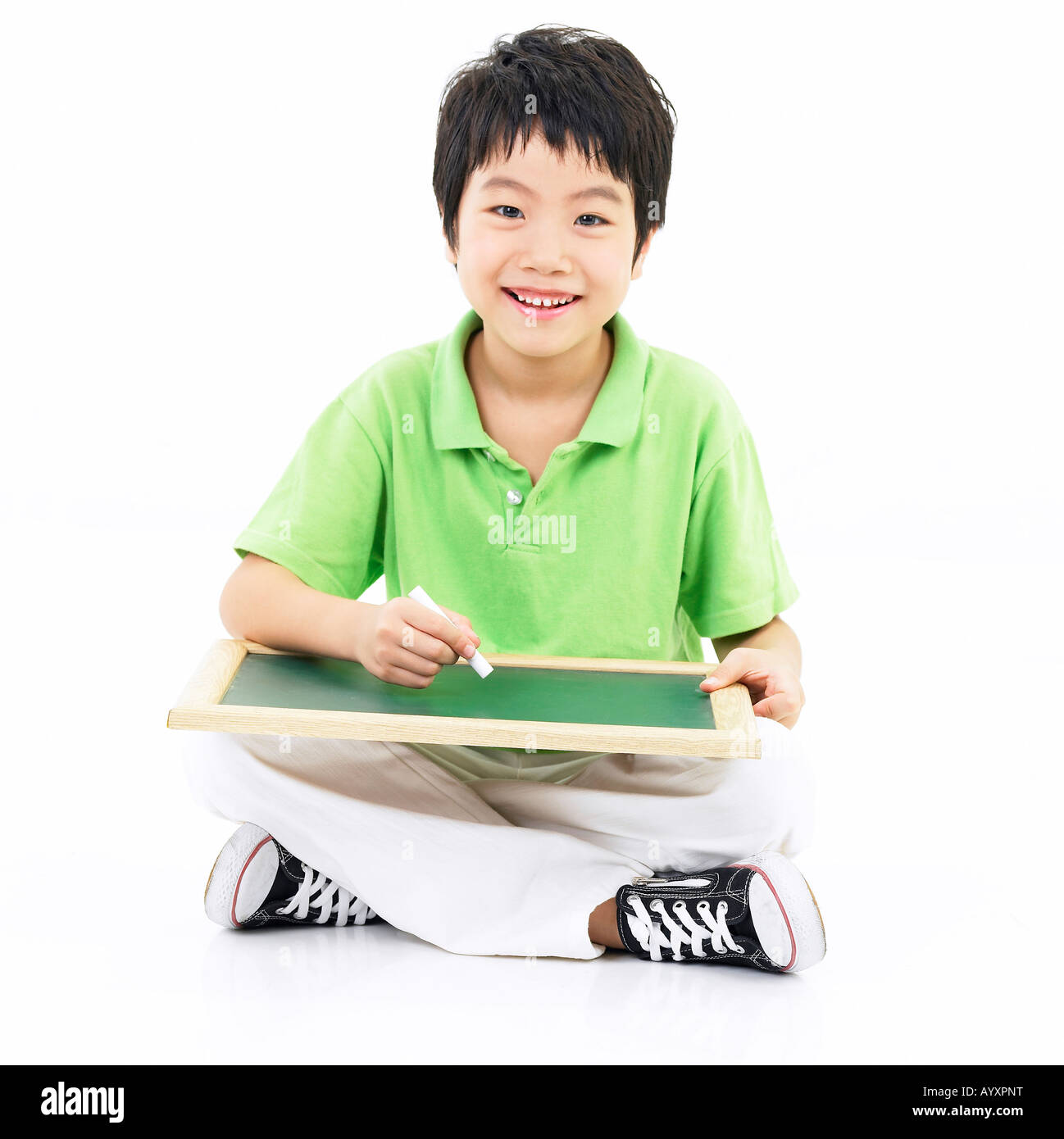 a boy writing a word on the black board Stock Photo - Alamy