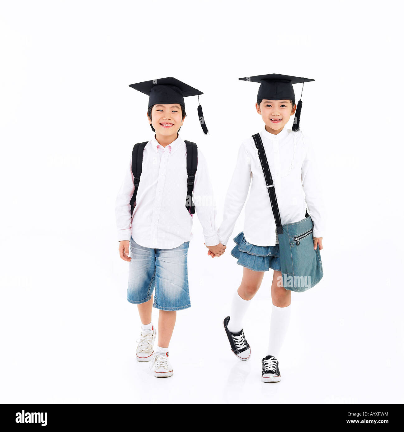 children smiling and wearing graduation hat Stock Photo - Alamy