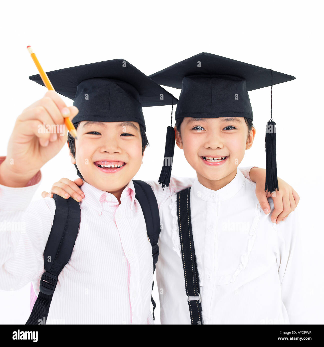 children smiling and wearing graduation hat Stock Photo - Alamy