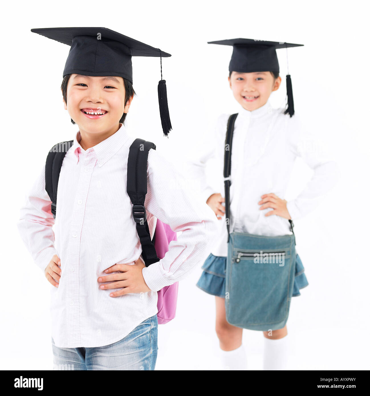 children smiling and wearing graduation hat Stock Photo - Alamy