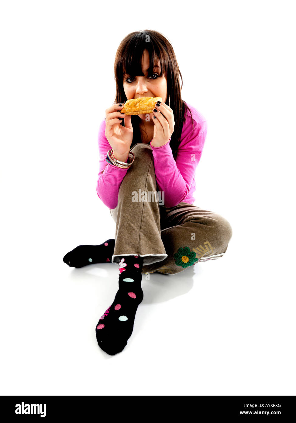 Teenage Girl Eating Pasty Model Released Stock Photo - Alamy