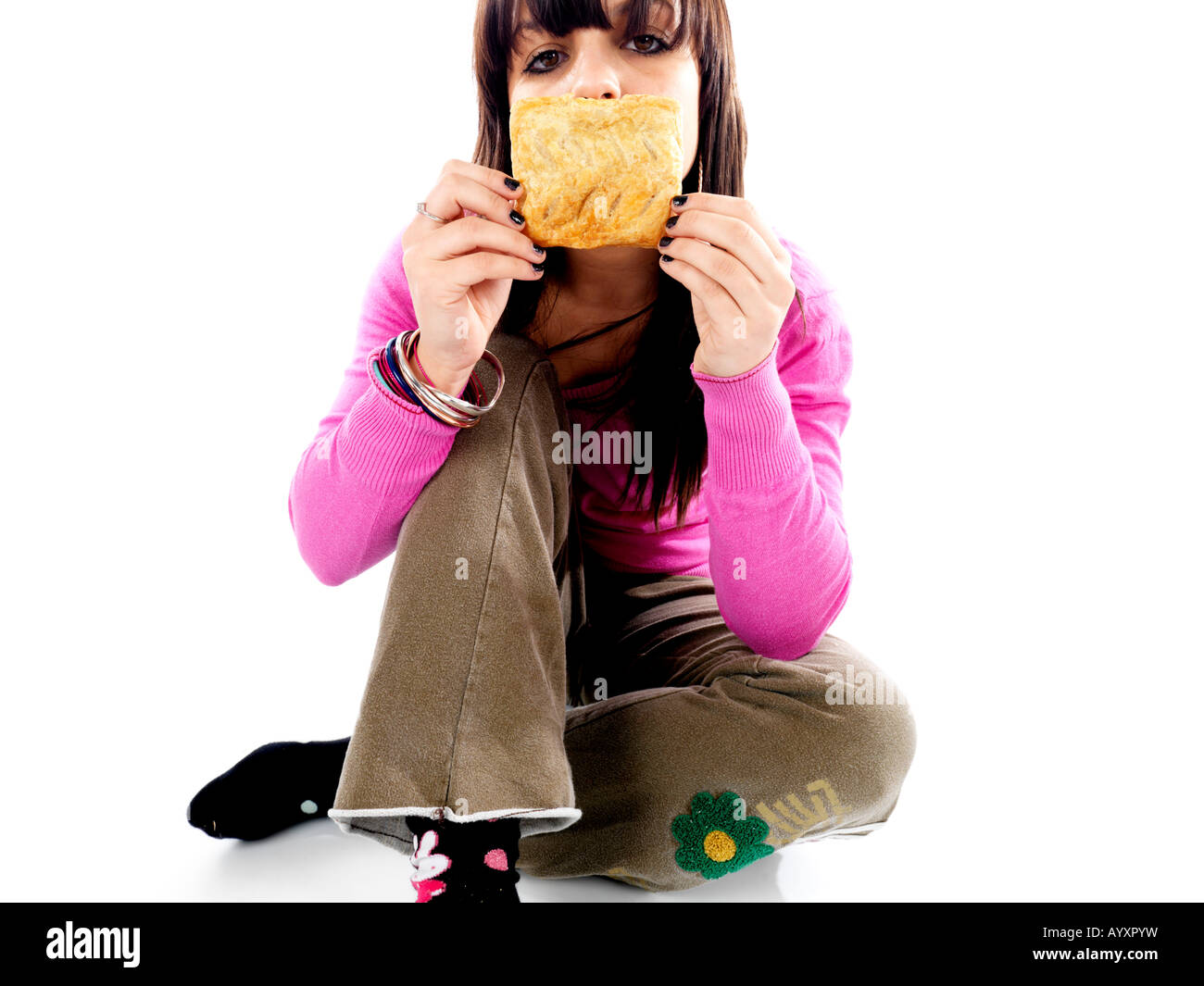Teenage Girl Eating Pasty Model Released Stock Photo - Alamy