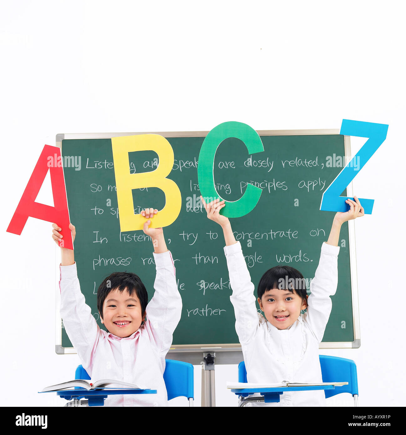 children holding an alphabet model Stock Photo - Alamy