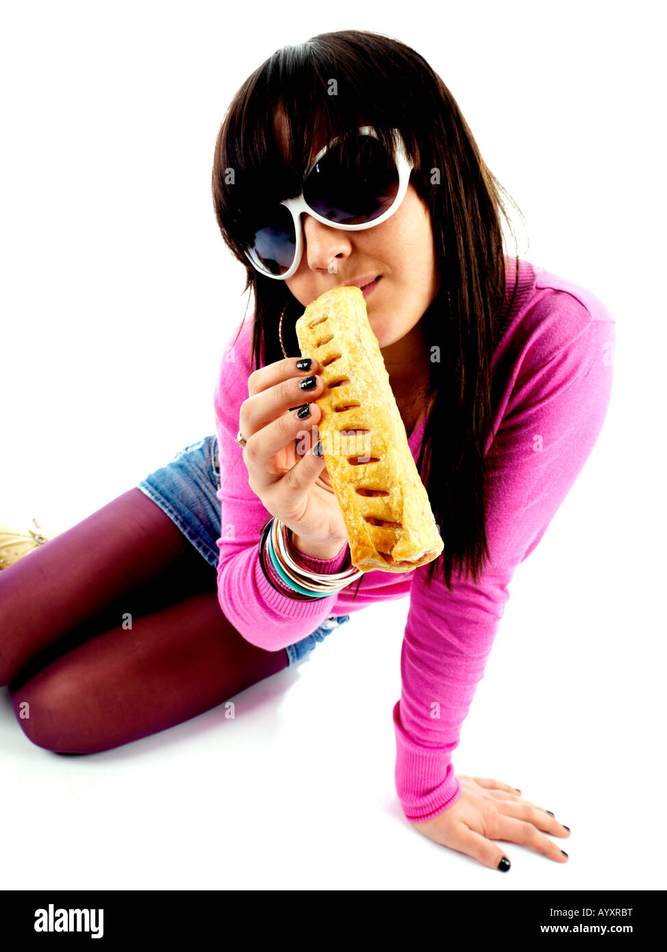Teenage Girl Eating Sausage Roll Model Released Stock Photo - Alamy