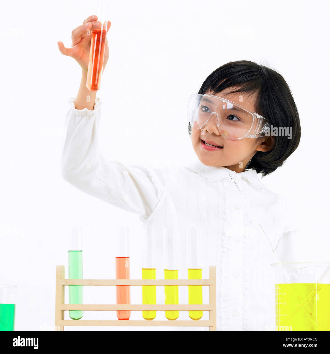 a girl making an experiment on science by a test tube Stock Photo - Alamy
