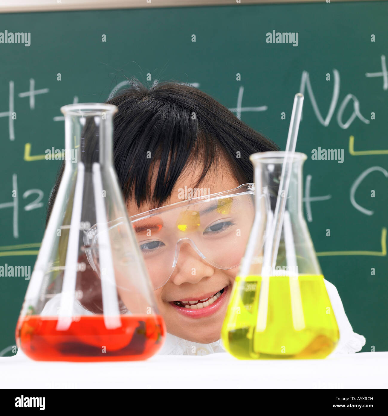 a girl making an experiment on science by a test tube Stock Photo - Alamy