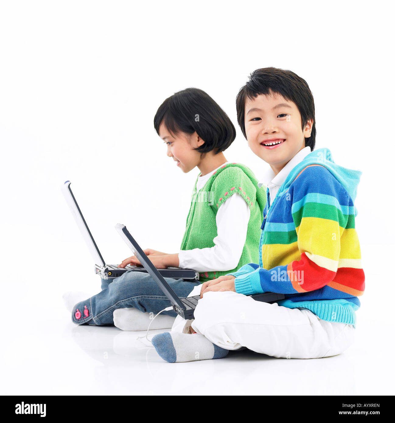 children using laptop computer with sitting on the floor Stock Photo ...