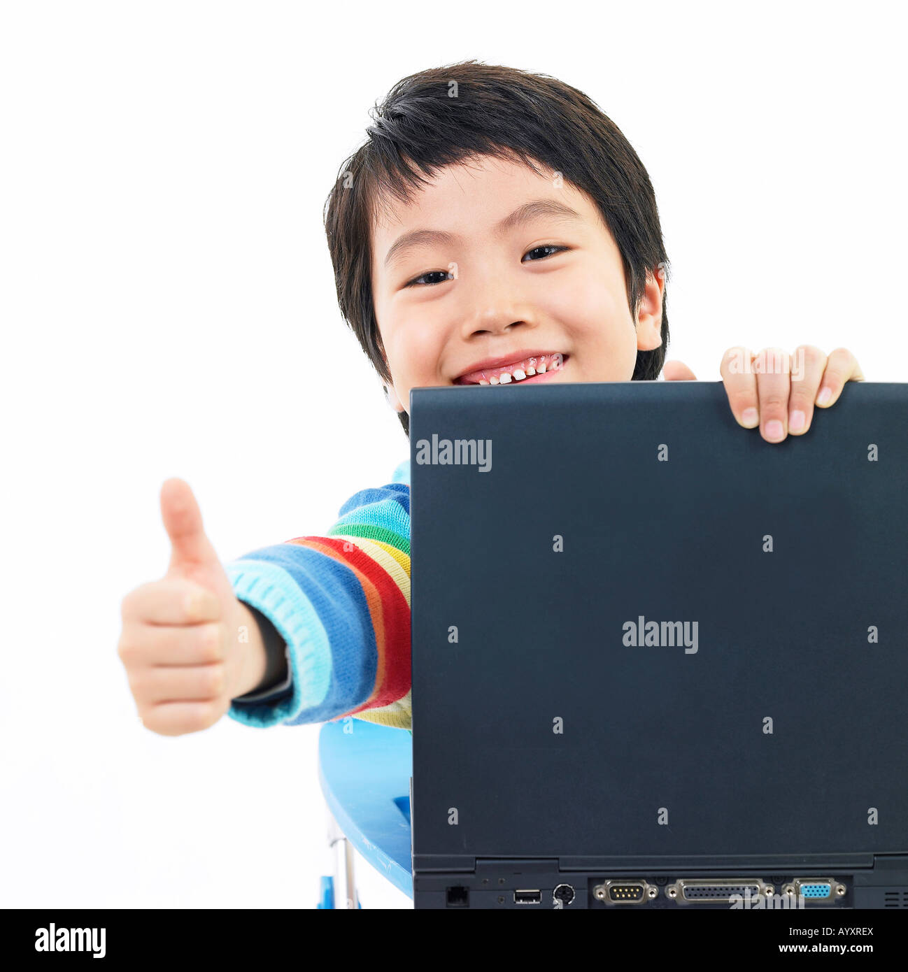 the boy looking at laptop computer with thumb up Stock Photo - Alamy