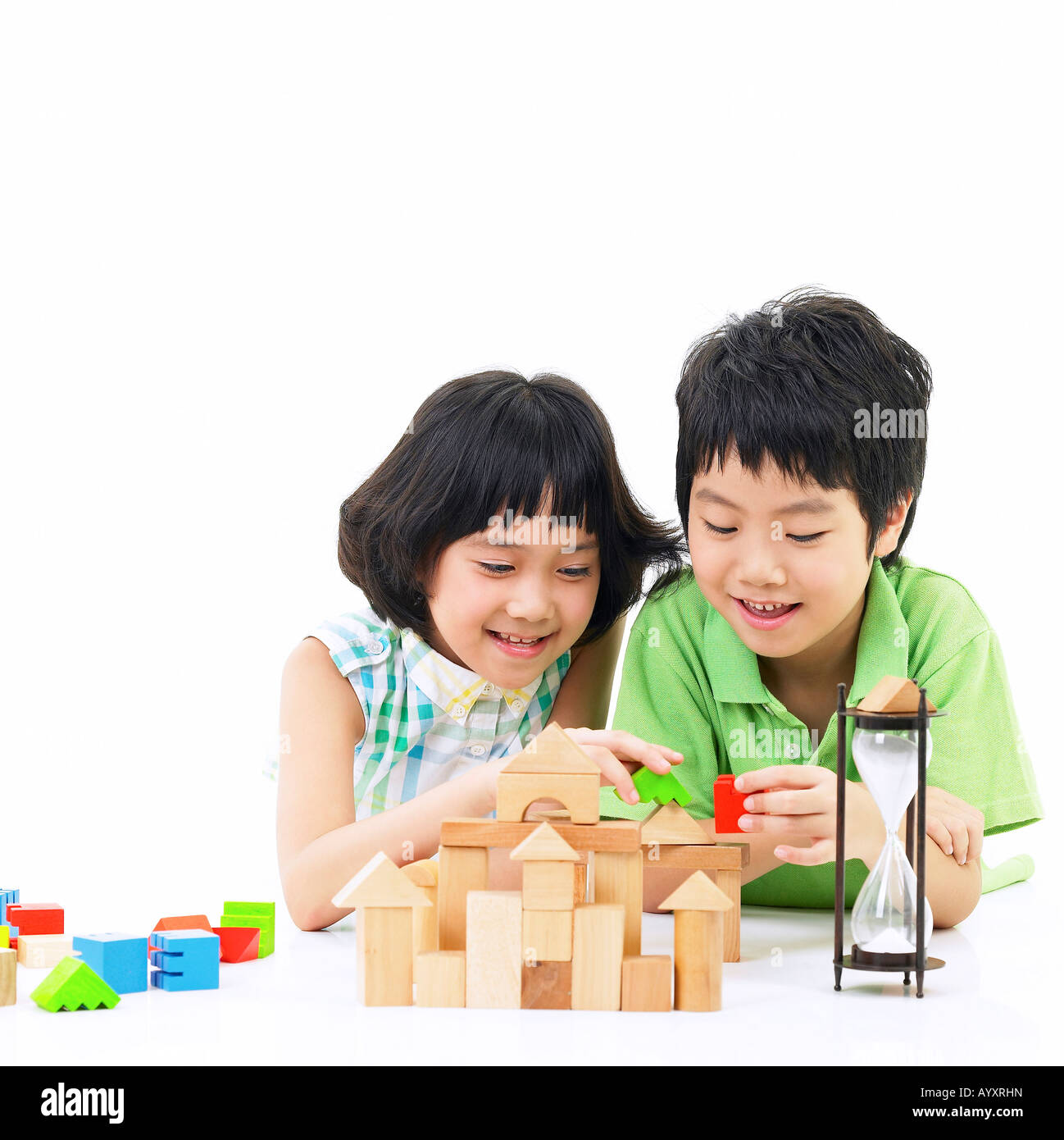 children making a stack of block Stock Photo - Alamy