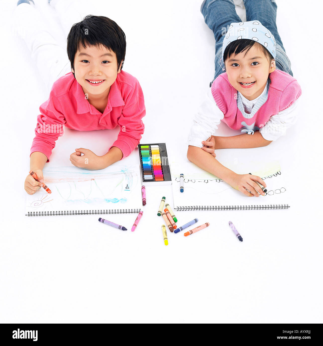 children drawing a picture with prostrating themselves on the floor ...