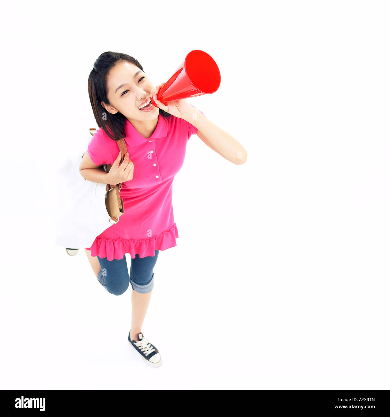 a girl student's look shouting with holding a red funnel Stock Photo ...