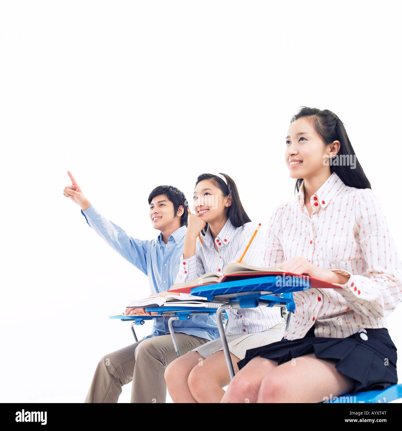 students studying with sitting on a chair and opening a book Stock ...