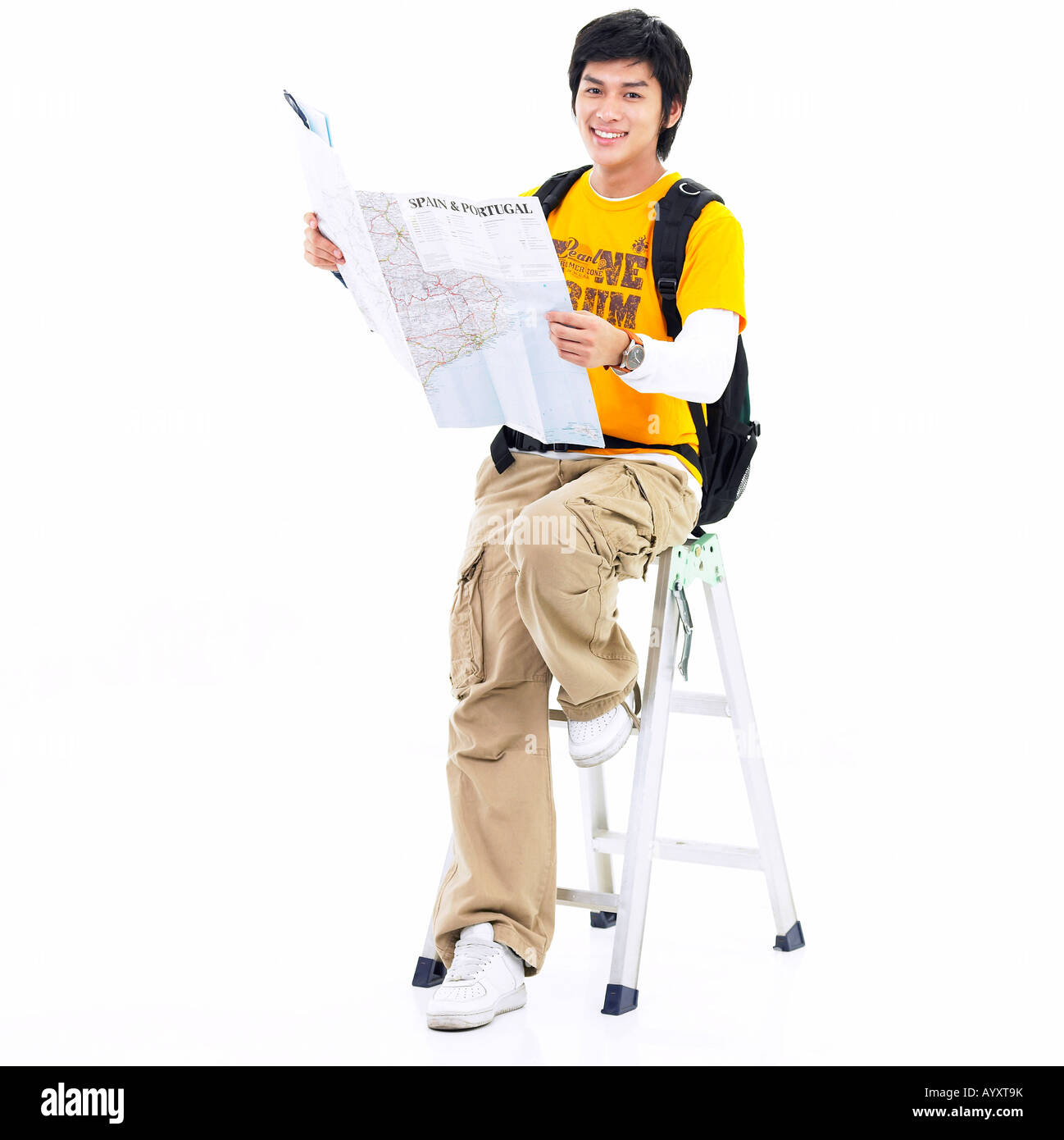 a boy student seeing a map with sitting a ladder Stock Photo - Alamy