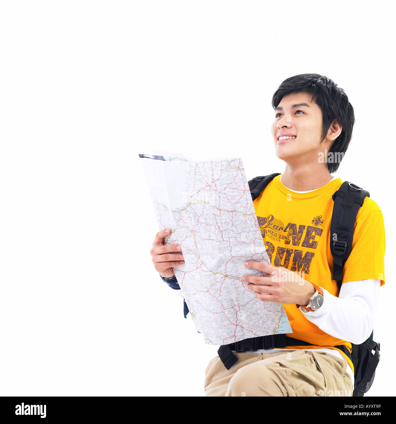 a boy looking at the sky with having a map Stock Photo - Alamy