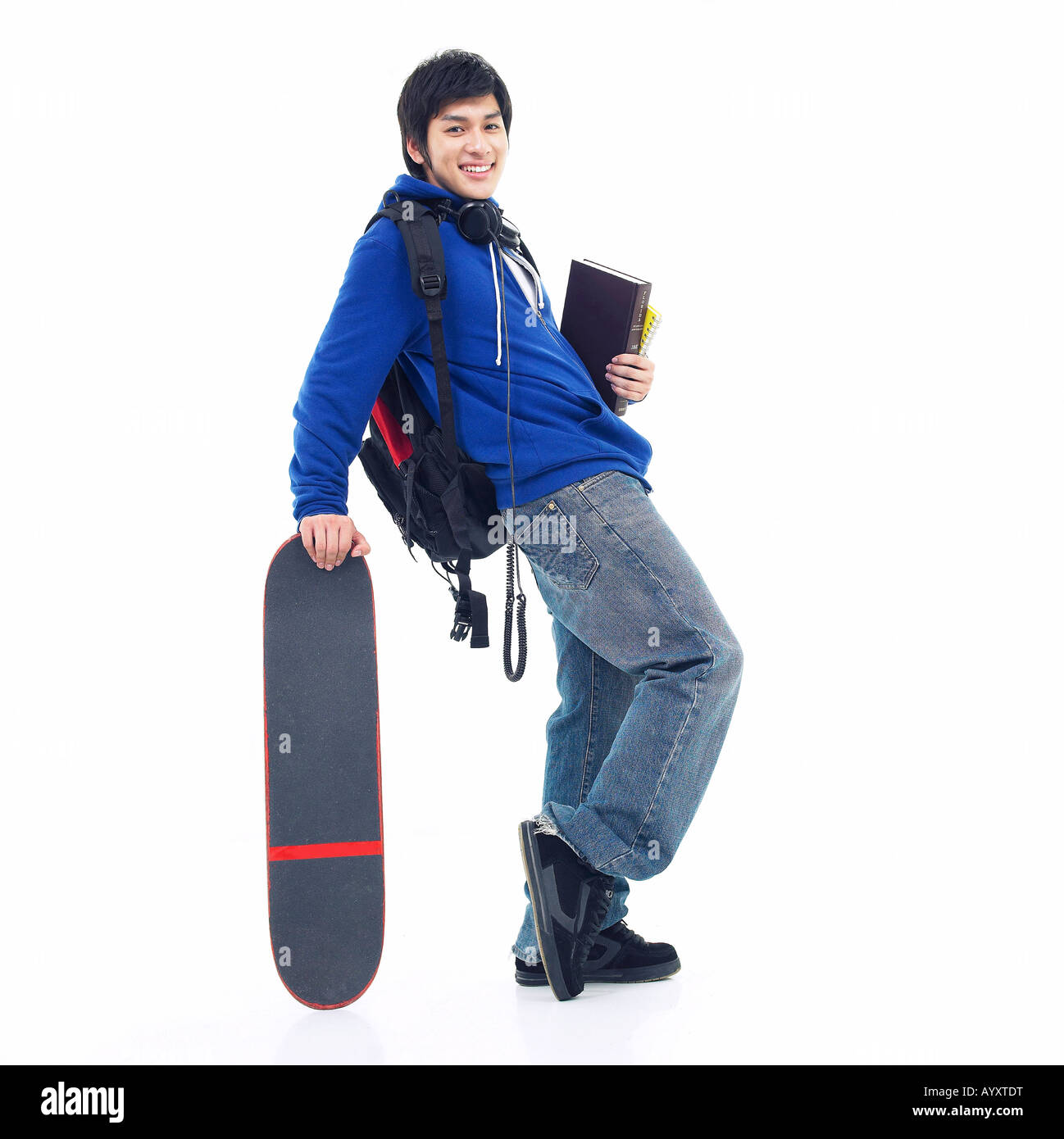 a boy student holding a book and a board Stock Photo - Alamy