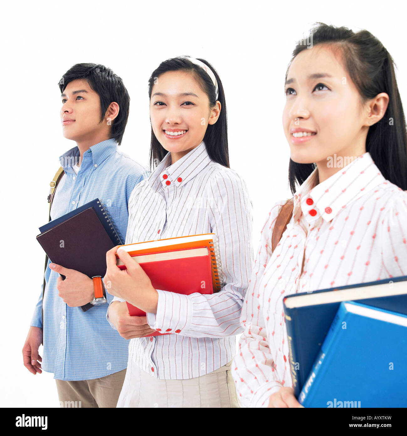 students standing in a row with holding a book and notebook Stock Photo ...