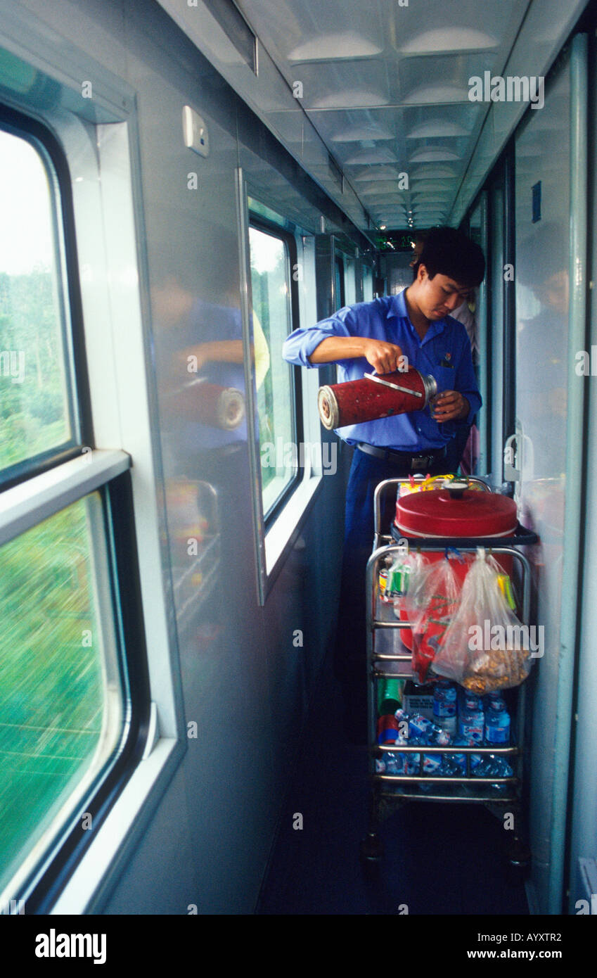 Waiter serving food and refreshments in the Reunification Express train ...