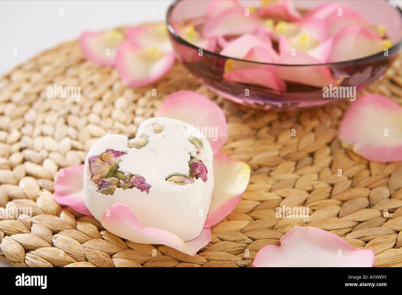 A heart-shaped piece of soap on rose petals Stock Photo - Alamy