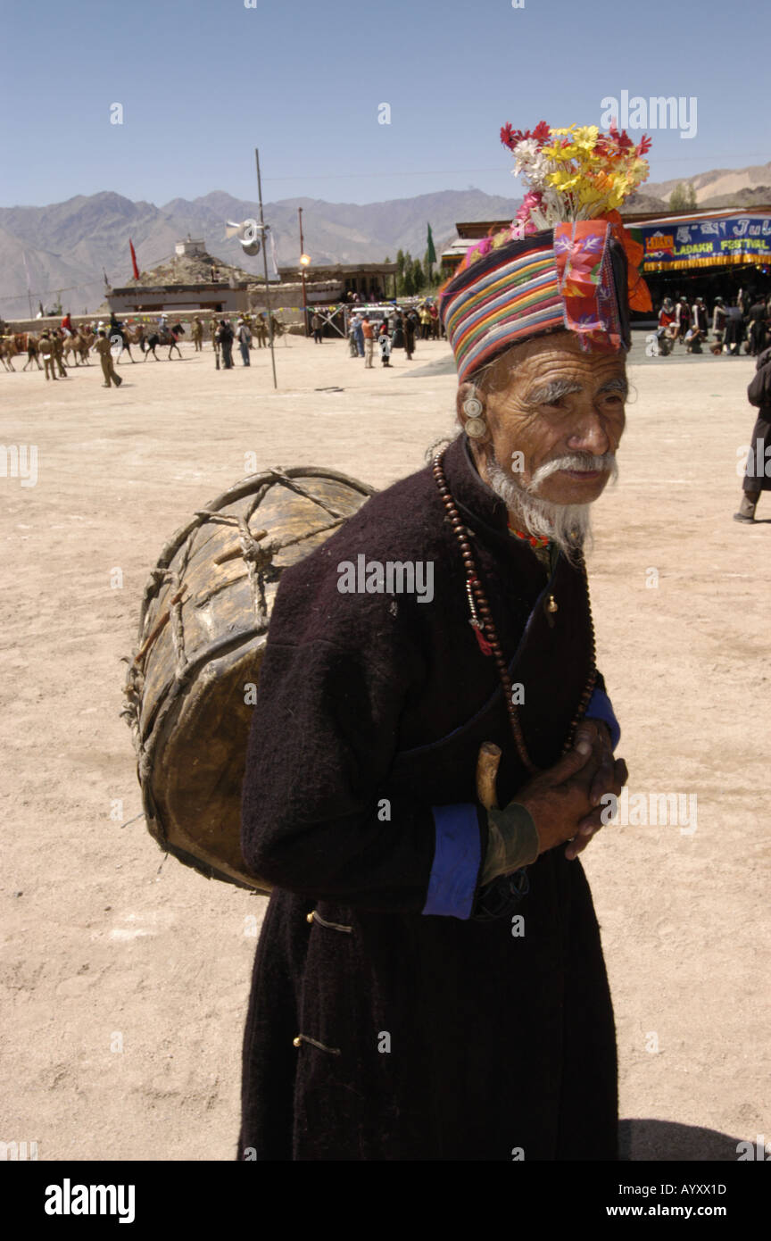 Man carrying drum Dard or Brokpa tribe from Dha Hanu Village in color ...