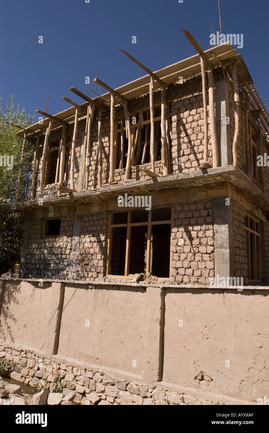 Construction works on traditional style clay brick building in Leh ...