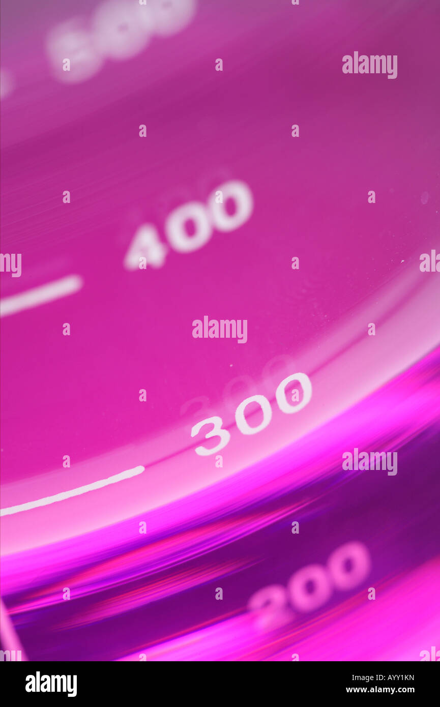 Laboratory vessel with pink liquid and measuring scale Stock Photo - Alamy